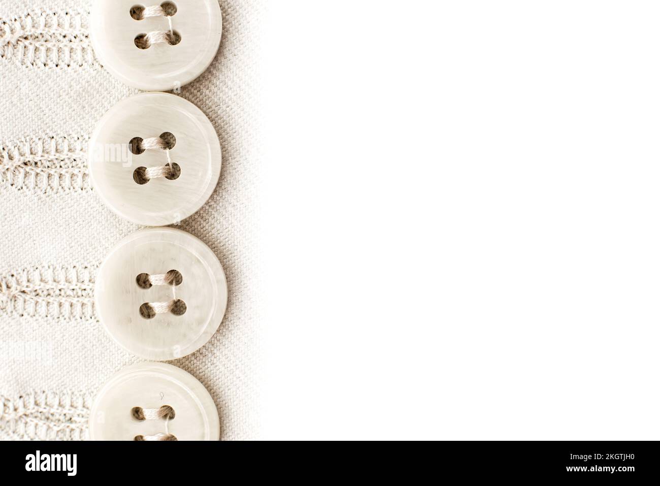 Buttons on the sleeve of a man's jacket on a white background with ...