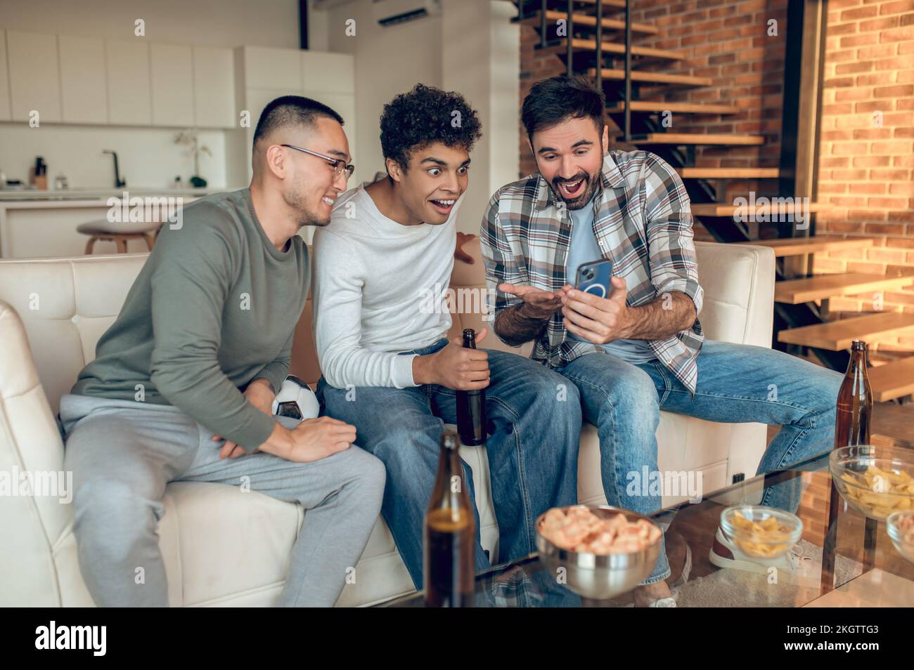 Cheerful guys hi-res stock photography and images - Alamy