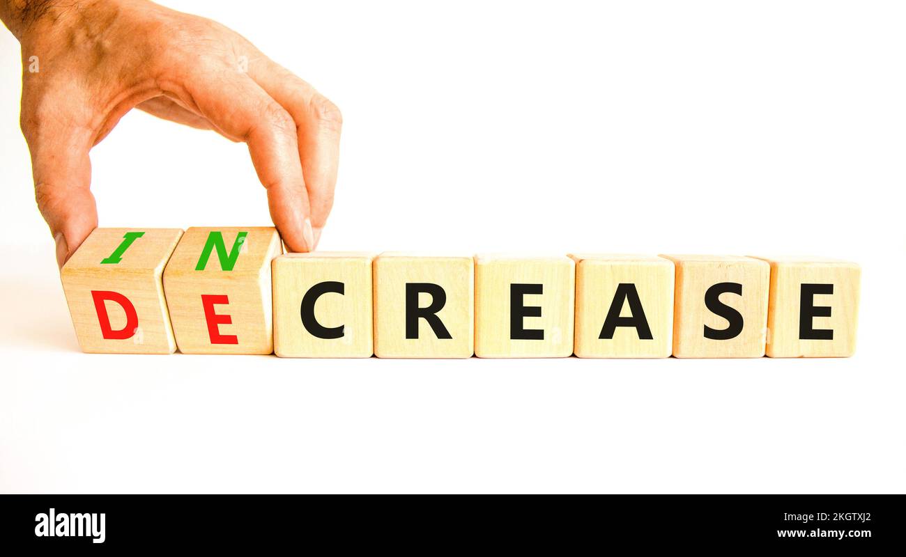 Increase or decrease symbol. Concept words Increase and Decrease on wooden cubes. Businessman ...