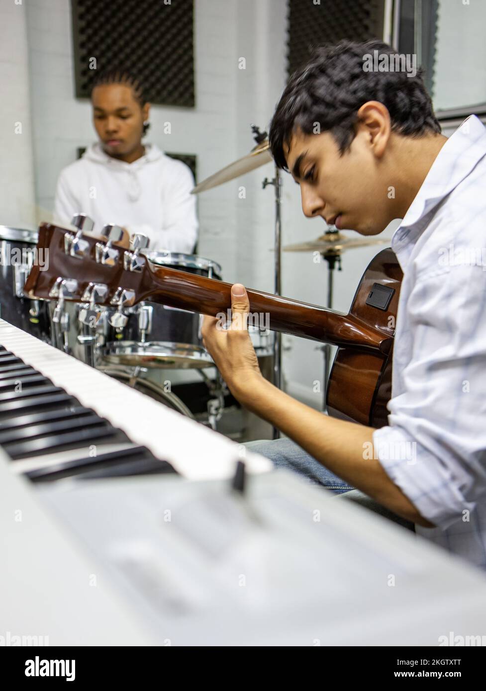 Music Students: Guitar Solo. A jamming session between a guitarist and ...