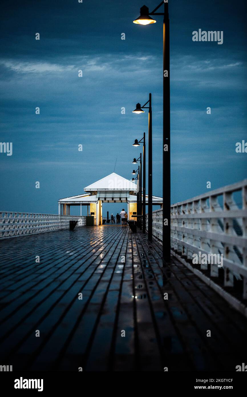 A vertical shot of the Shorncliffe pier with road lighting in the ...