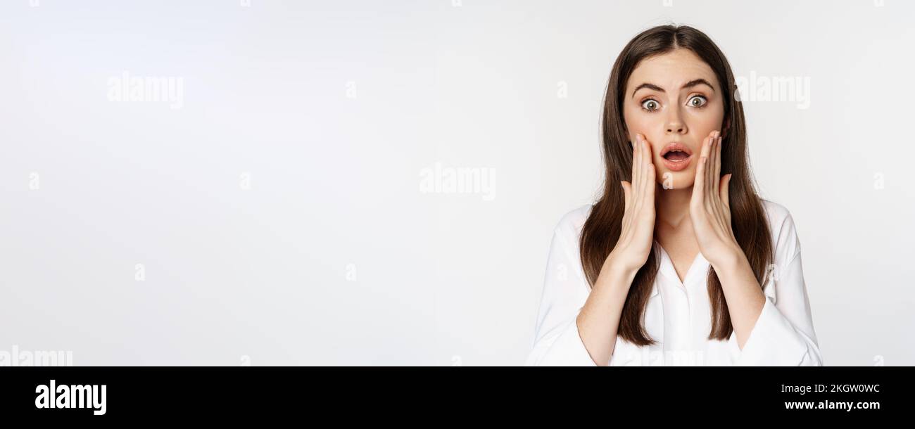 Close up of shocked woman gasping, looking stunned and speechless ...