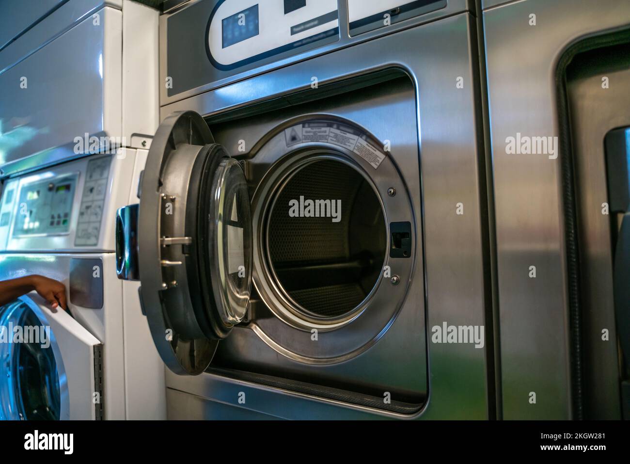 Commercial washer at a communal self-service laundromat Stock Photo - Alamy
