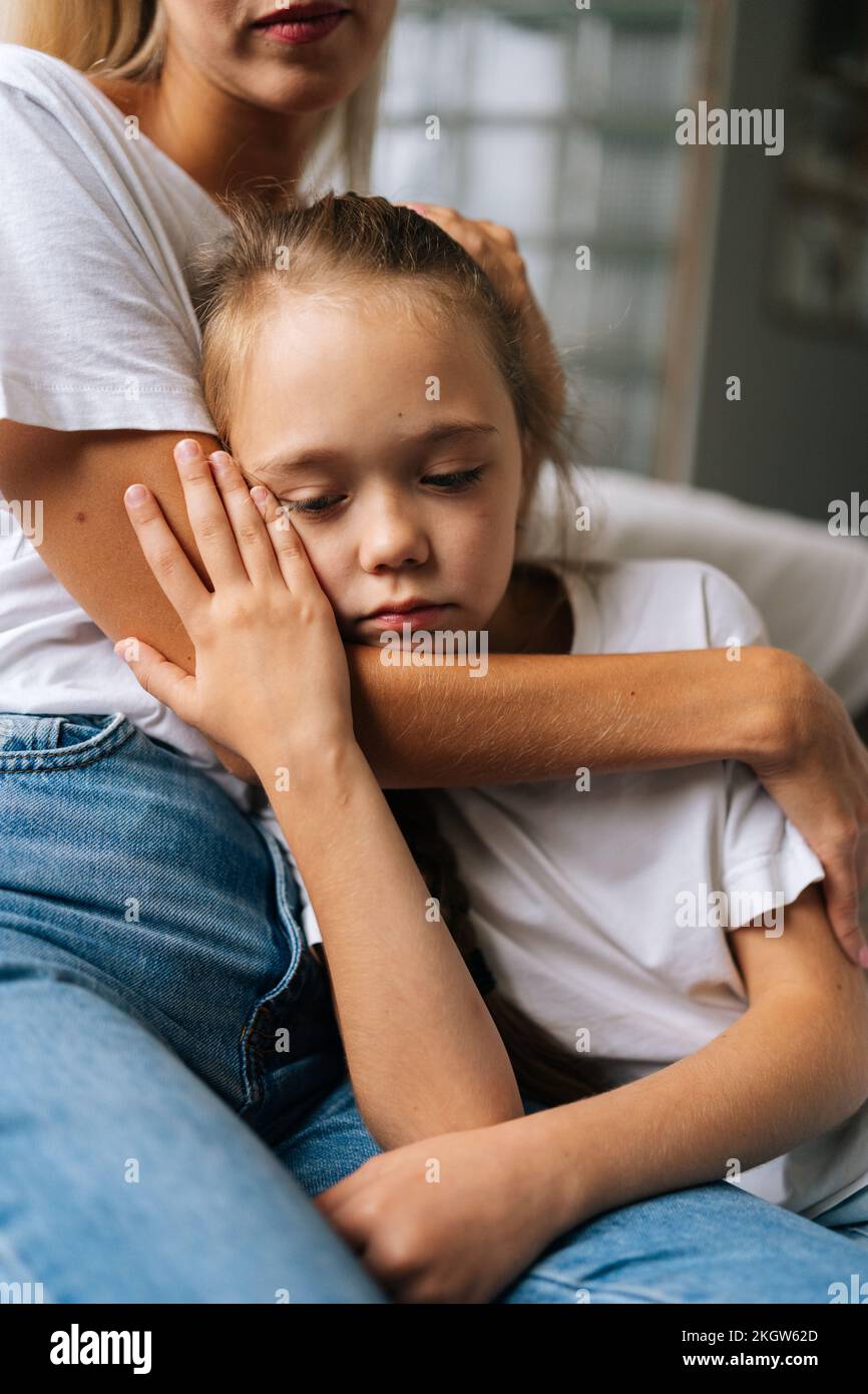 Mother comforting daughter eyes closed hi-res stock photography and images - Alamy