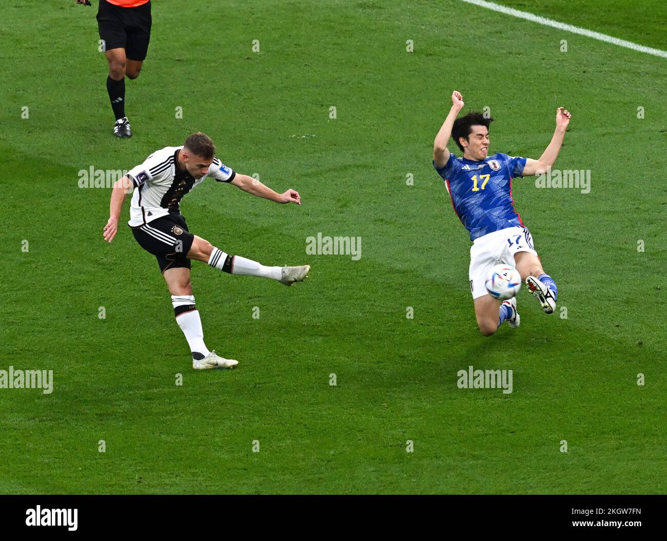 Doha, Qatar. 23rd Nov, 2022. Tanaka Ao (R) of Japan blocks a shot from ...