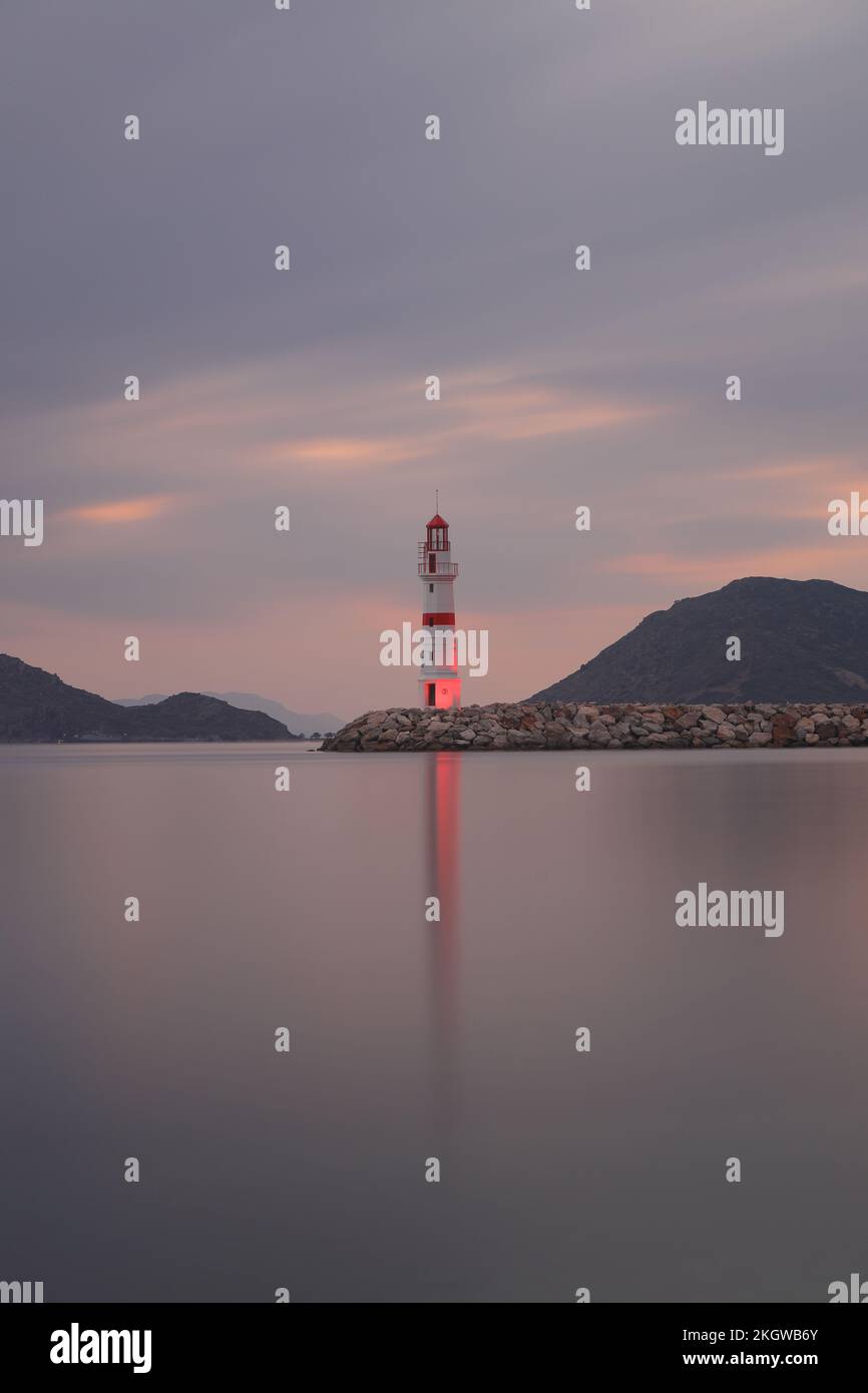 Seascape at sunset. Lighthouse on the coast. the lighthouse used for ...