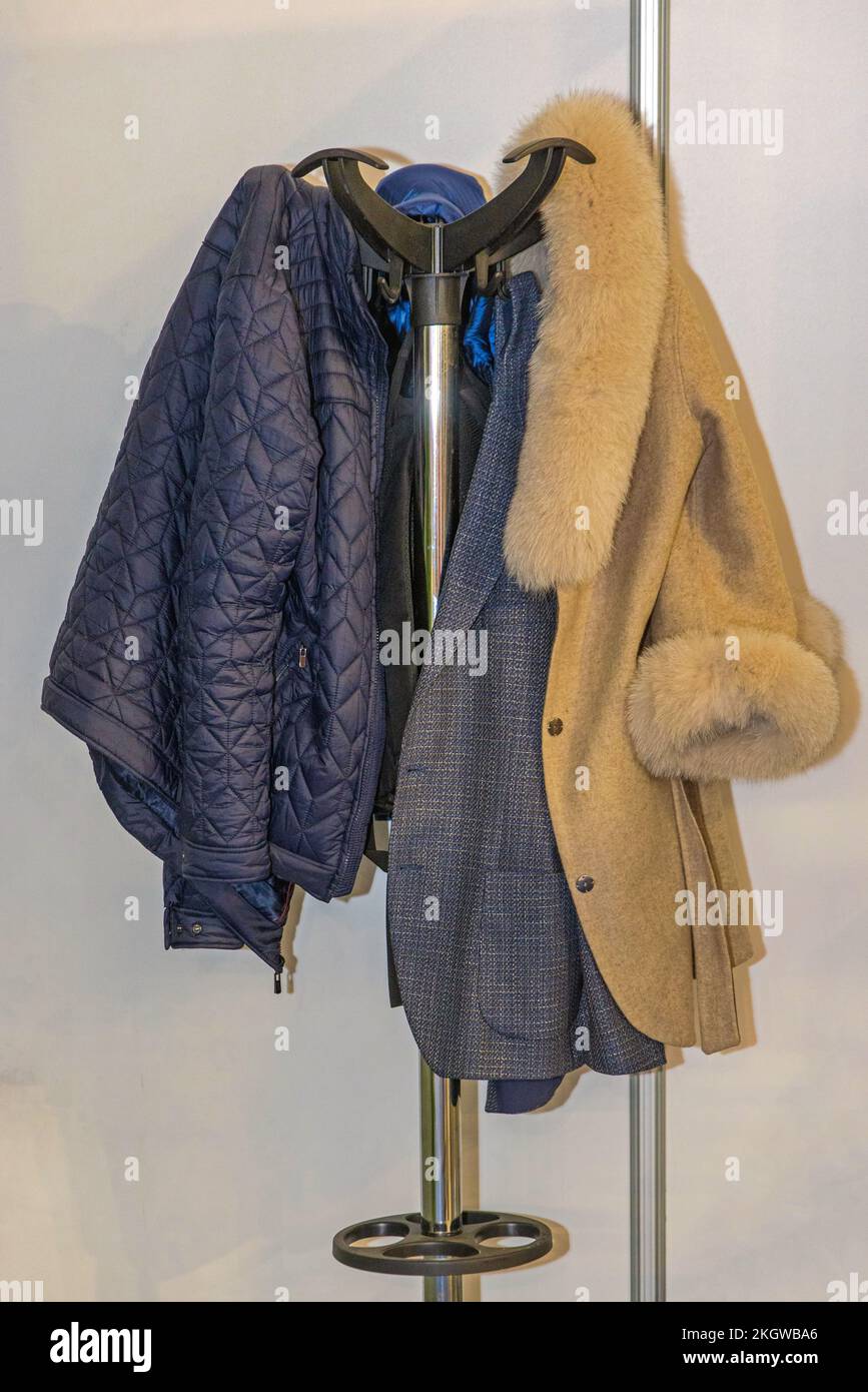 Winter Clothing Jackets and Coats at Coat Stand Stock Photo - Alamy