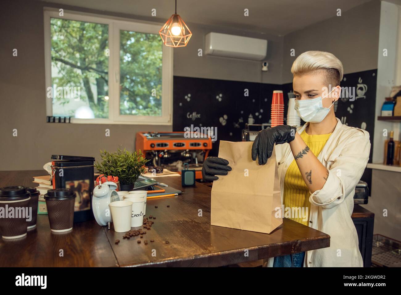 Person handling coffee bag hi-res stock photography and images - Alamy