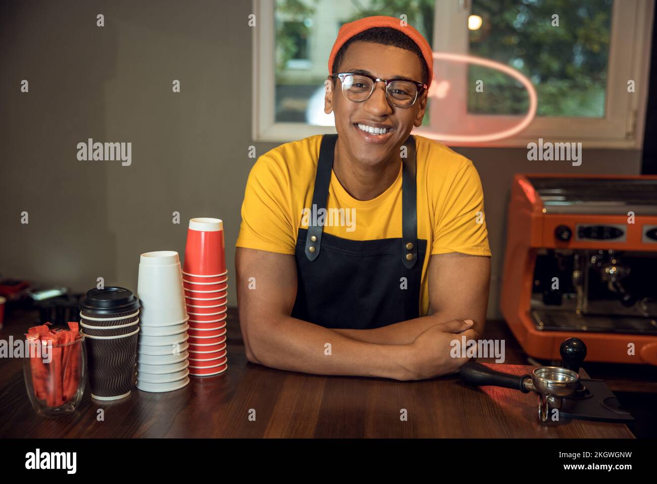 Smiling happy barista posing for the camera in his workplace Stock ...