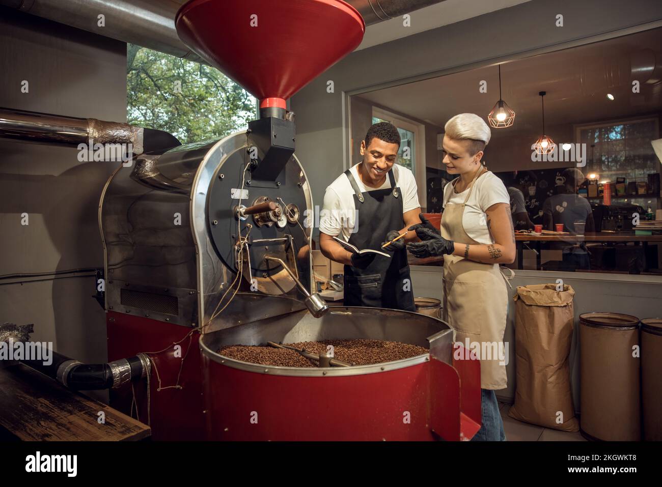 Two coffee company workers involved in work Stock Photo - Alamy