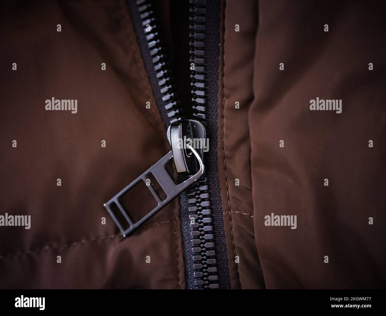 The zipper of a brown coat. Close up Stock Photo - Alamy