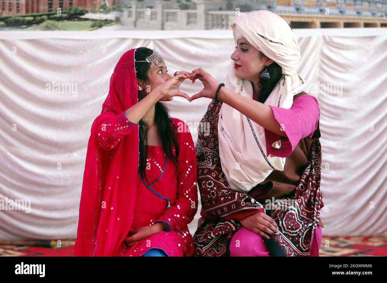 Students are presenting tableaus on stage during a ceremony on the eve ...