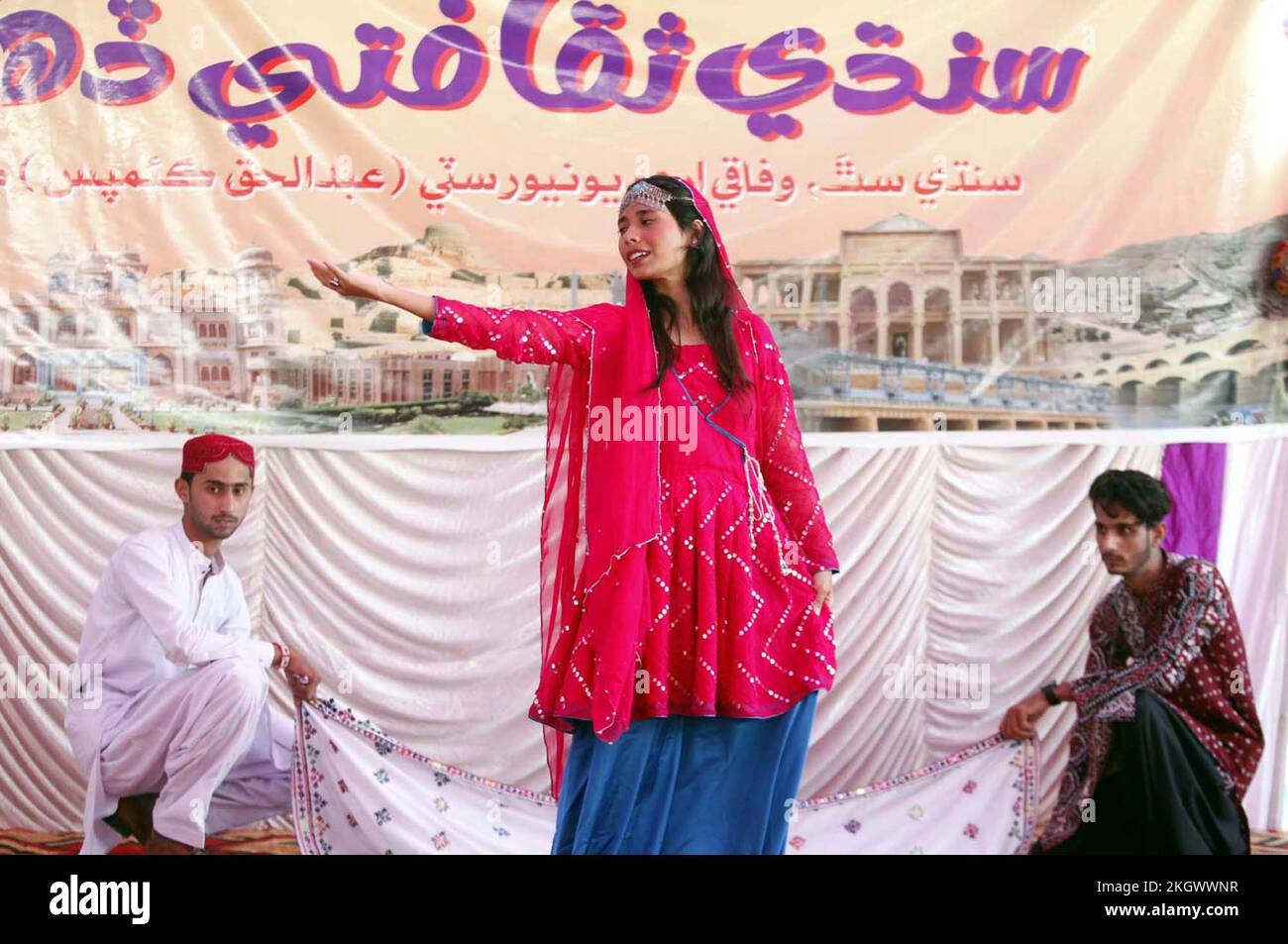 Students are presenting tableaus on stage during a ceremony on the eve ...