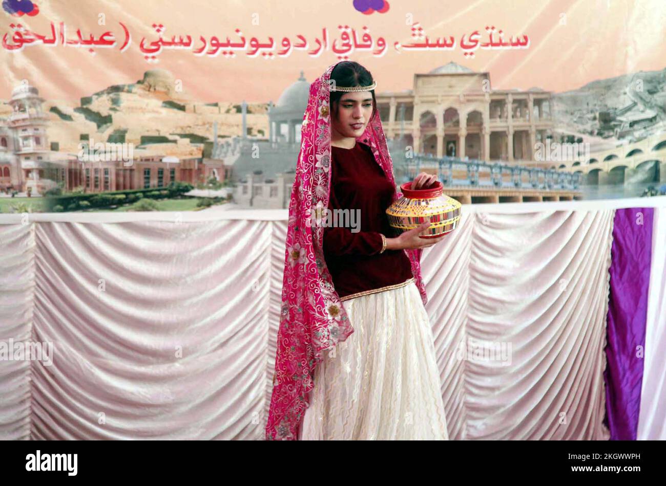 Students are presenting tableaus on stage during a ceremony on the eve ...