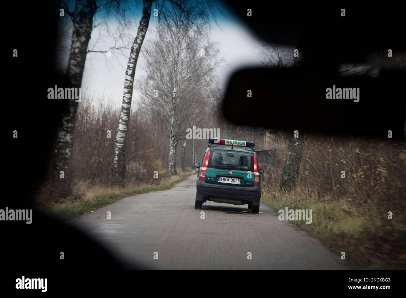 Members of the Polish Border Guards escort journalists towards the ...