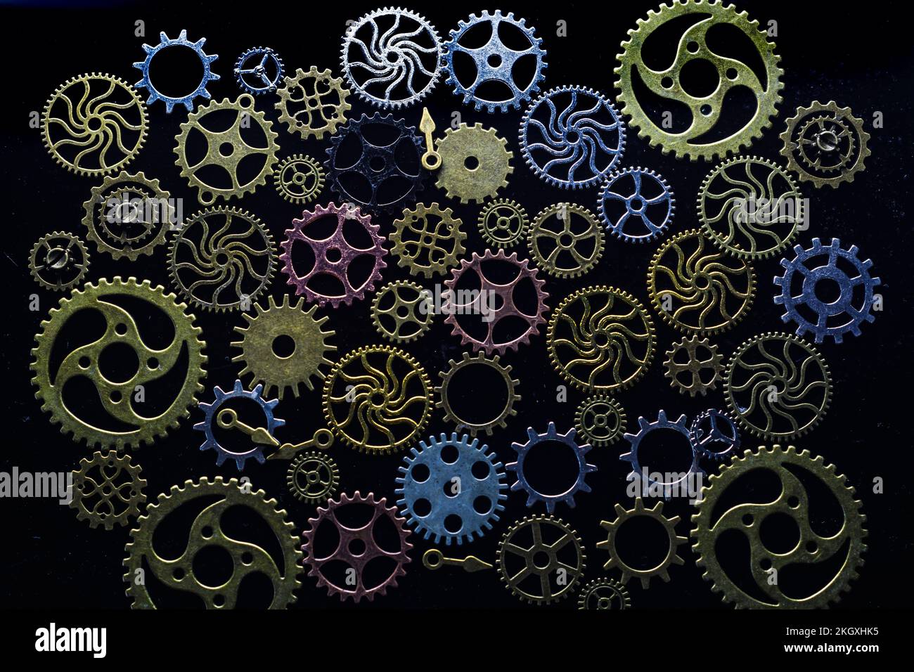 Cogs and wheels on a black background Stock Photo - Alamy