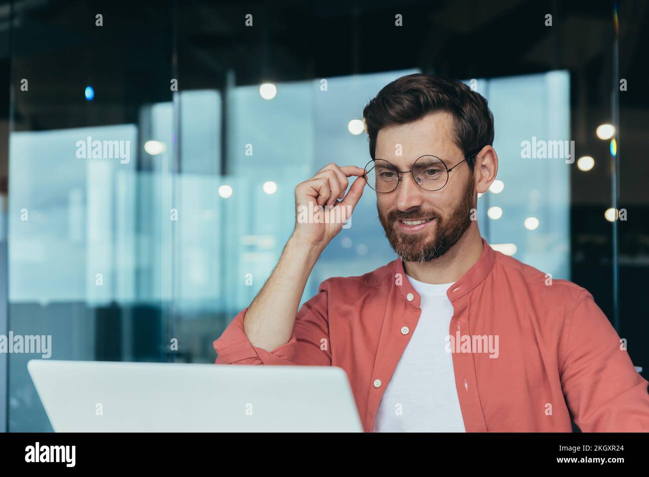 Close-up photo of successful and happy architect working inside modern ...