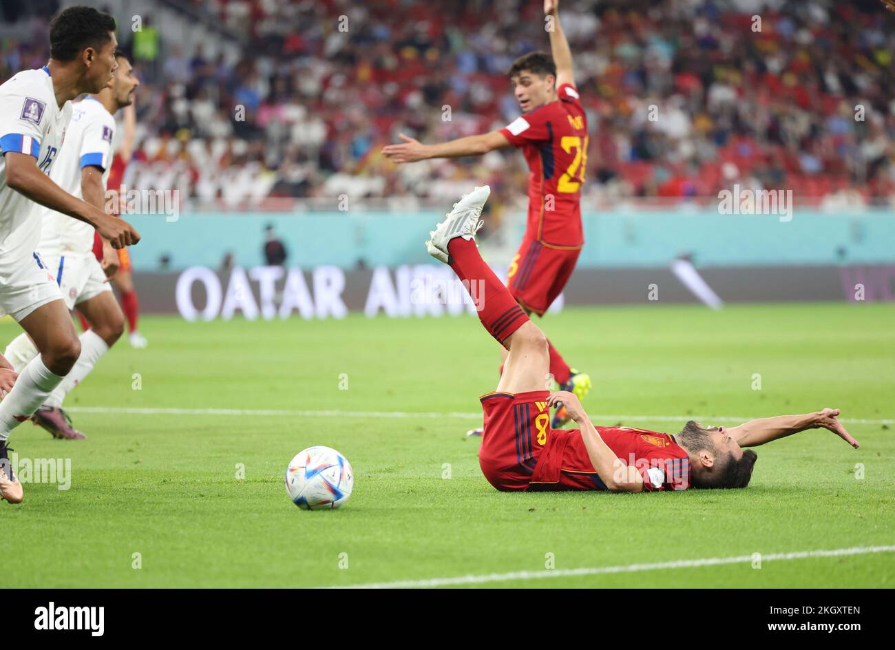 Doha, Qatar. 23rd Nov, 2022. Jordi Alba (R) of Spain is fouled during ...