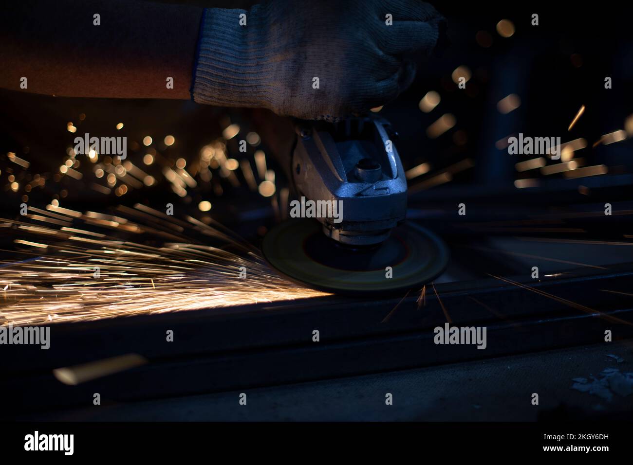 Grinding of steel. Sparks from metal. Hot particles. Small lights. Work ...
