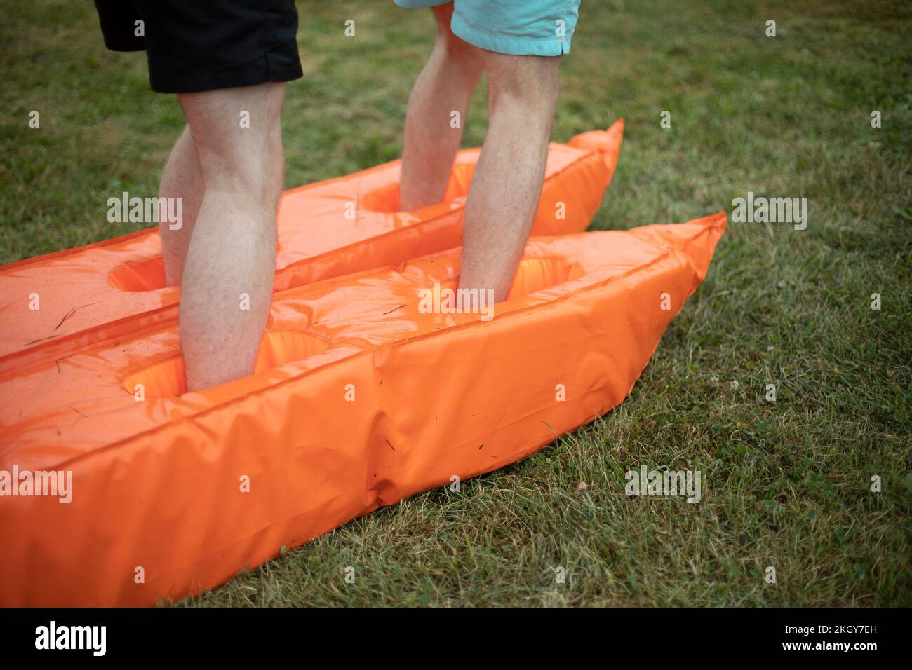 Men feet in shorts. Sports competition in stadium. Fun sport. Leg ...