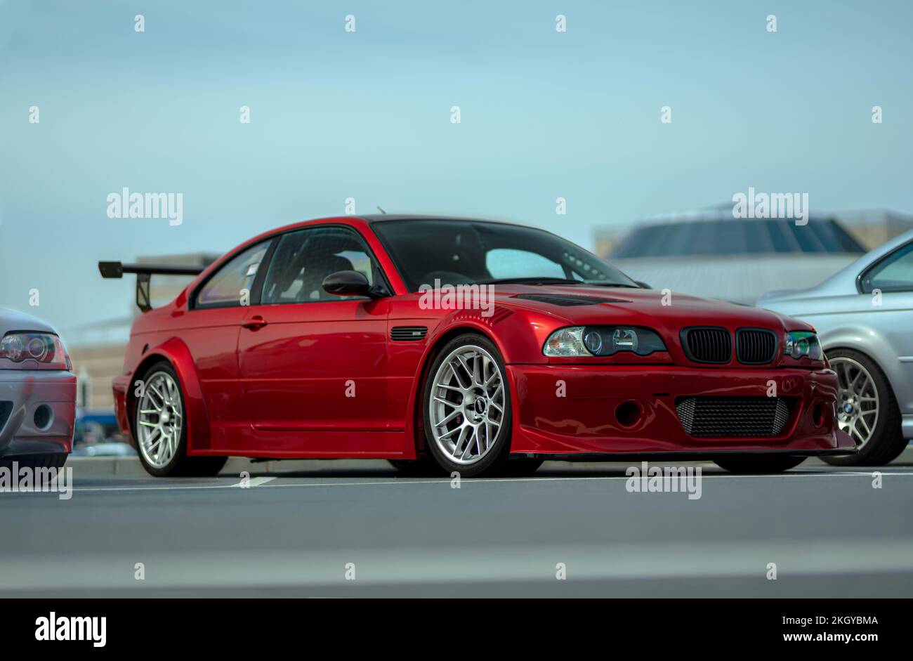 A red modern BMW M3 CSL on the road surrounded by other cars Stock ...