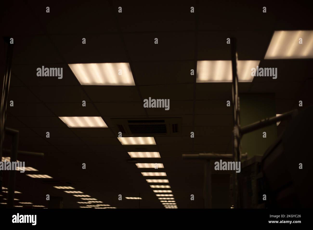Ceiling with fluorescent lamps. Interior of store in detail. Ac light ...
