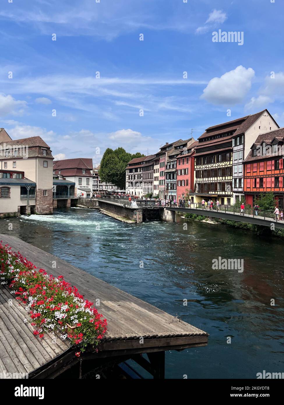 A vertical view of a beautiful river flowing in the Strasbourg city ...