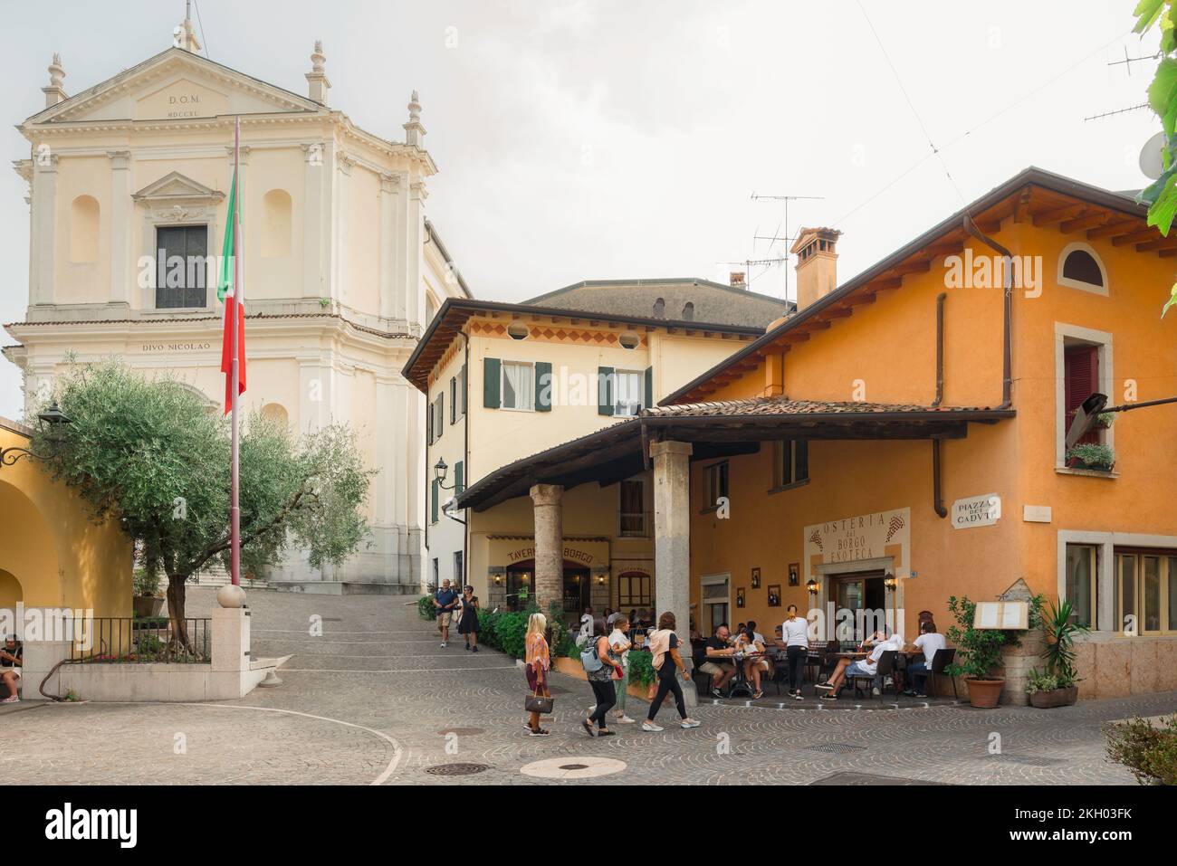Gardone Lake Garda, view in summer of a group of young people ...