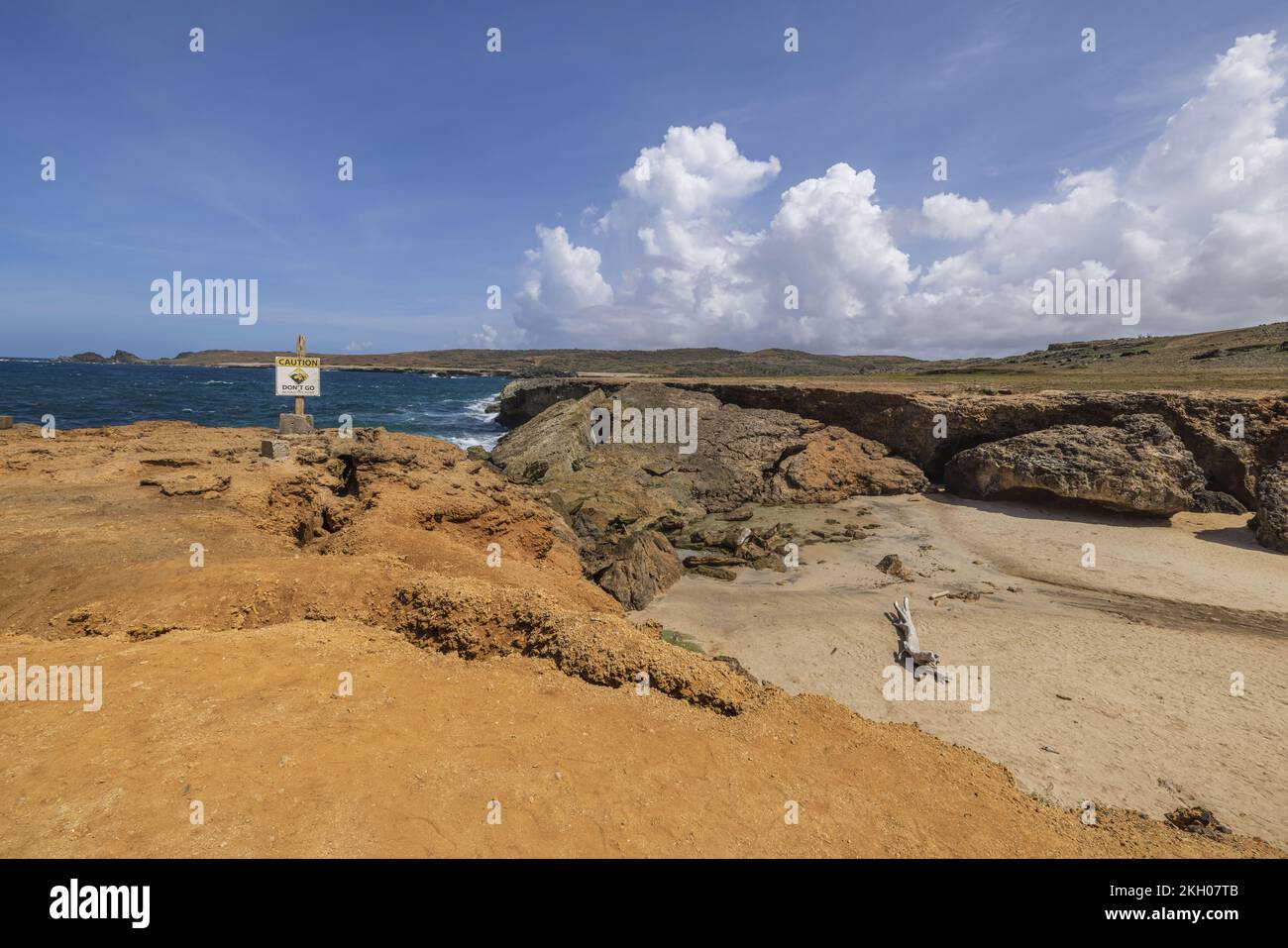 View of collapsed natural bridge and sign of danger of further collapse ...