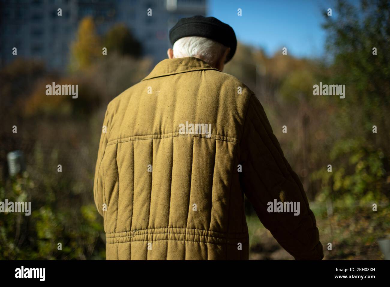 Old man from behind in autumn. Grandfather in garden. Man in old ...