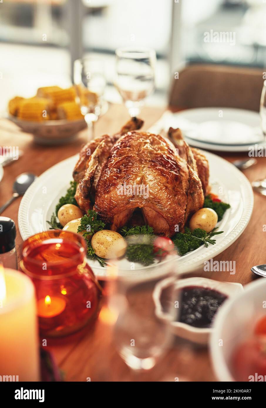 Thanksgiving, food and celebration with a turkey serving on a table in ...