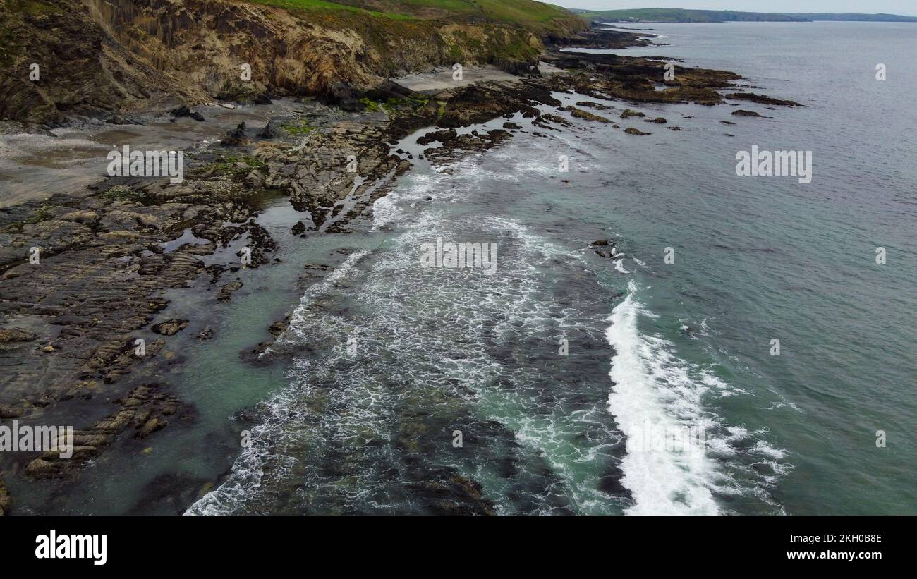 Tidal waves of the Atlantic Ocean. Rocks on the coast of the island of ...