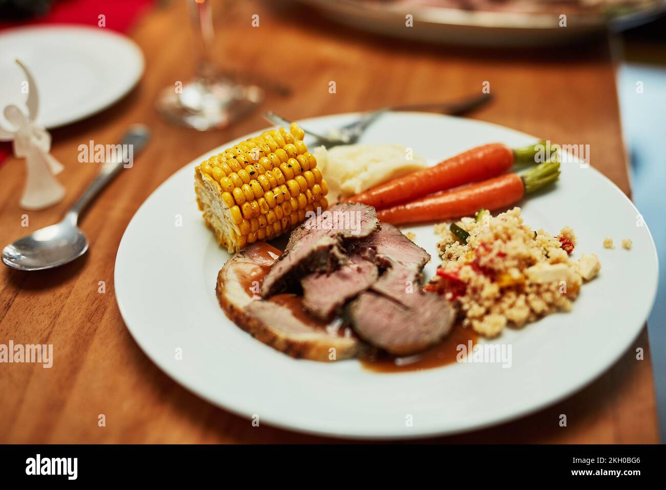 Home cooking, plate of food and Christmas celebration at dinner table ...