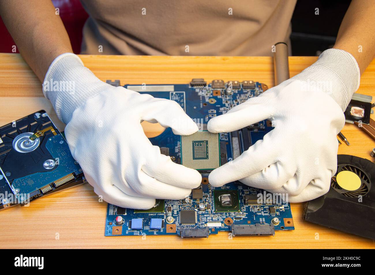 Technician repairing computer motherboard, notebook motherboard Stock Photo - Alamy