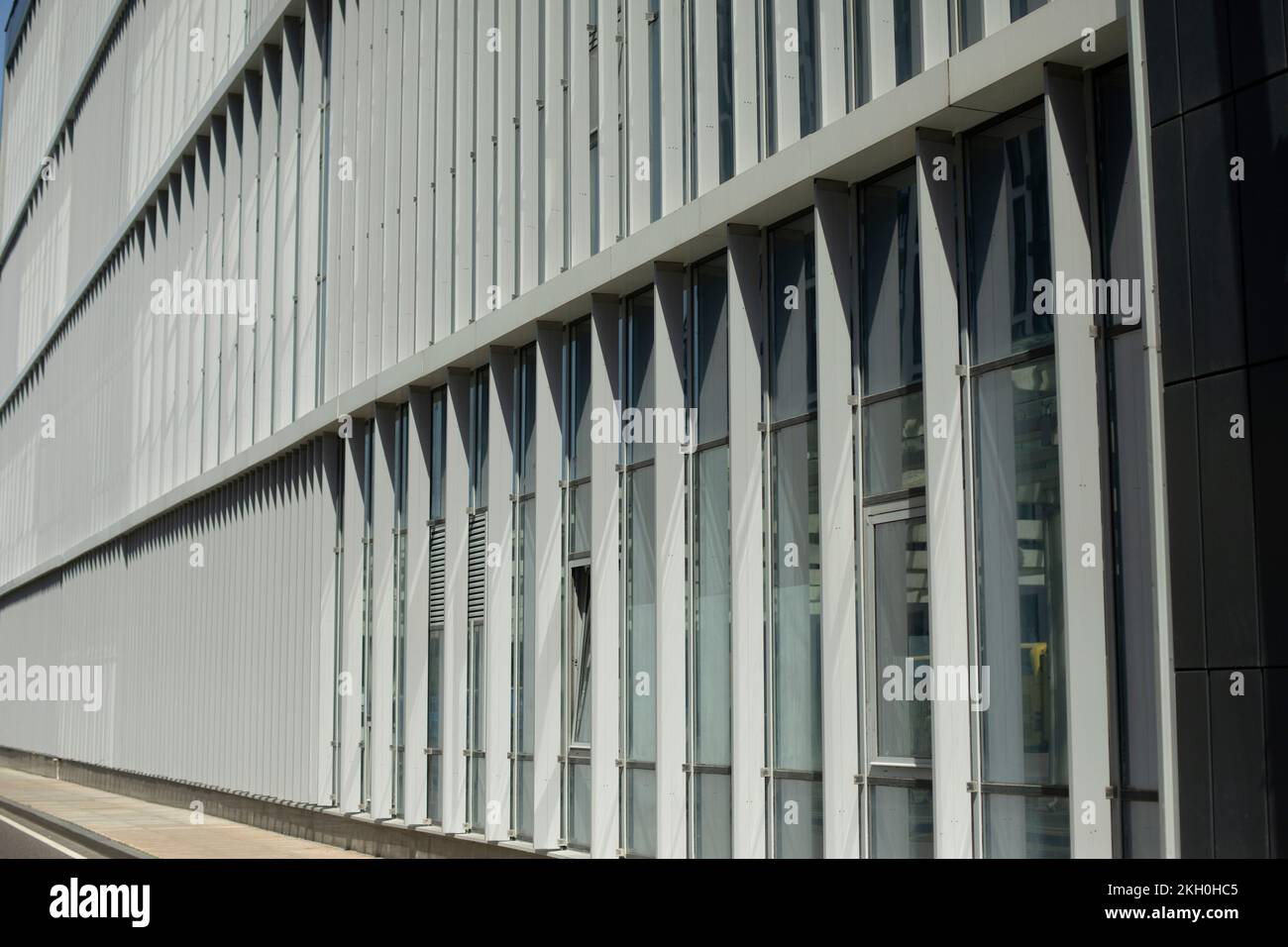 Building is outside. Windows in building. Vertical lines in ...