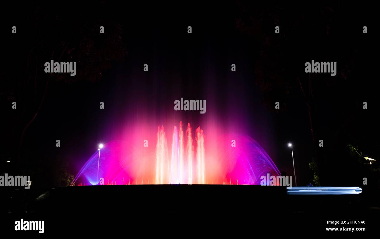 A long exposure shot of an illuminated fountain at night Stock Photo ...