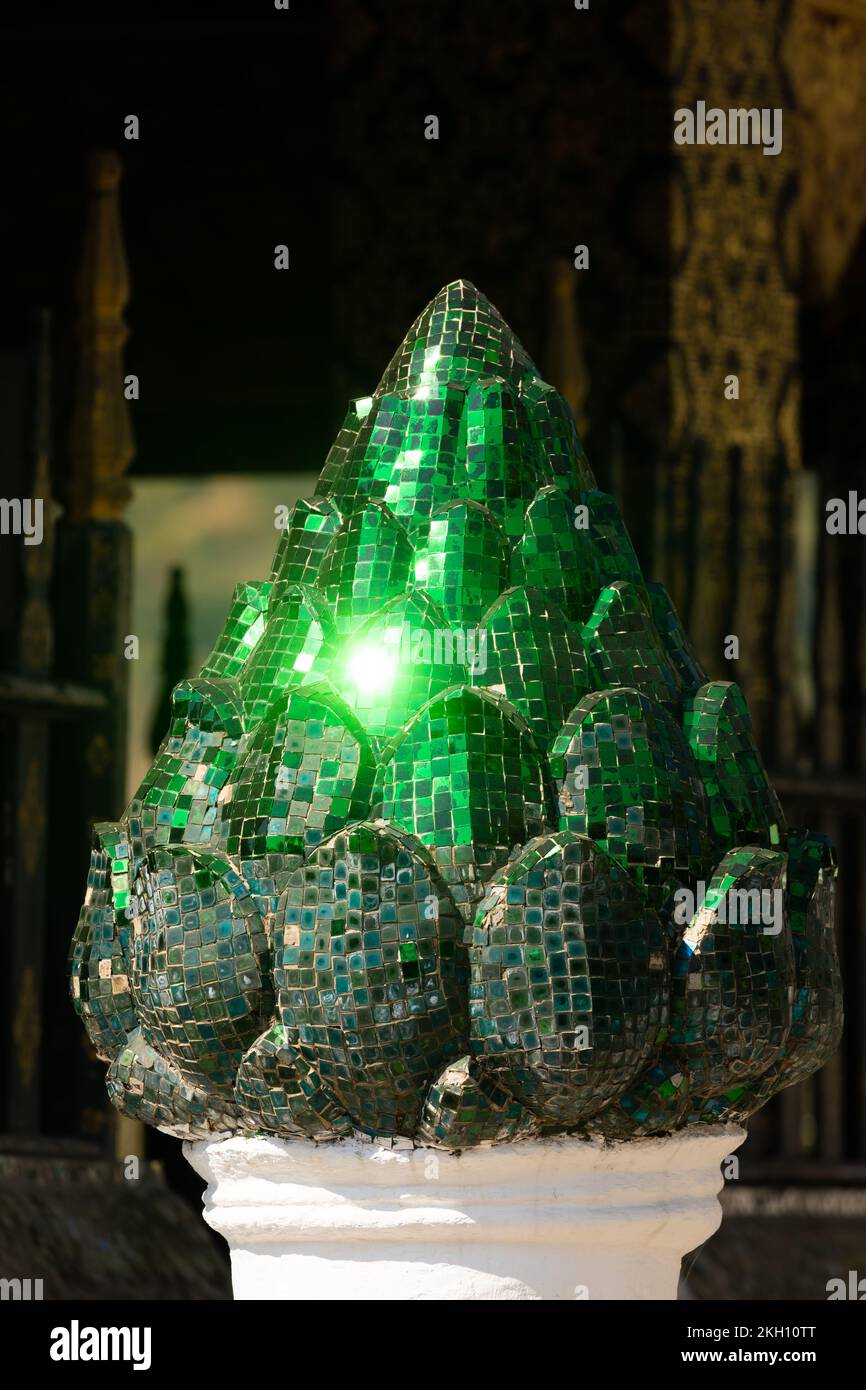 Figure of a fruit or pineapple, decorated with bright green glass, at ...