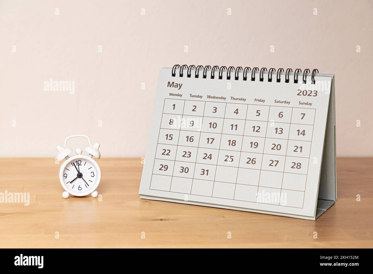 May 2023 calendar and small vintage clock on the desk Stock Photo - Alamy