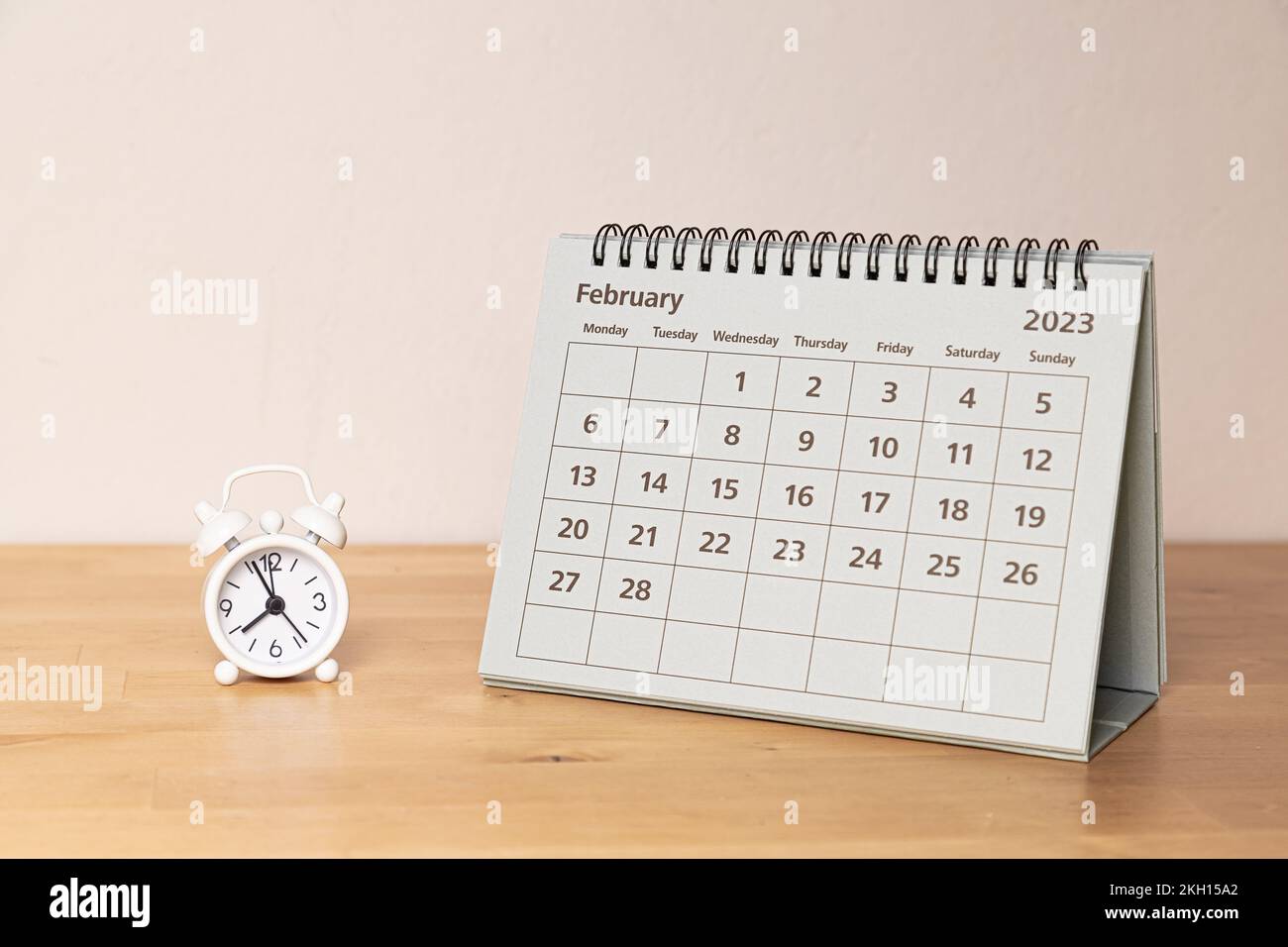 February 2023 calendar and small vintage clock on the desk Stock Photo ...