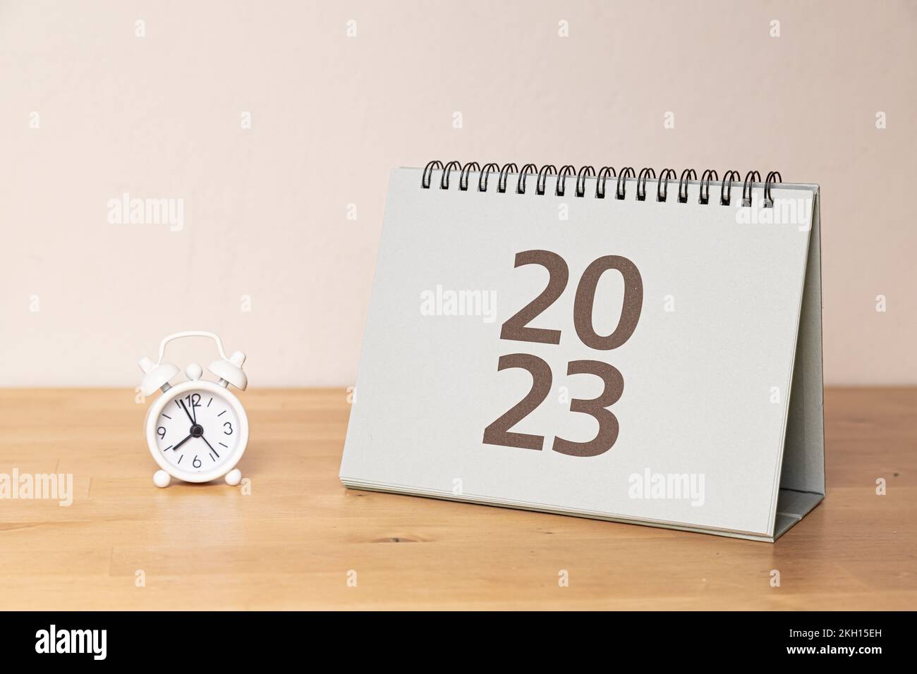 2023 calendar and small vintage clock on the desk Stock Photo - Alamy