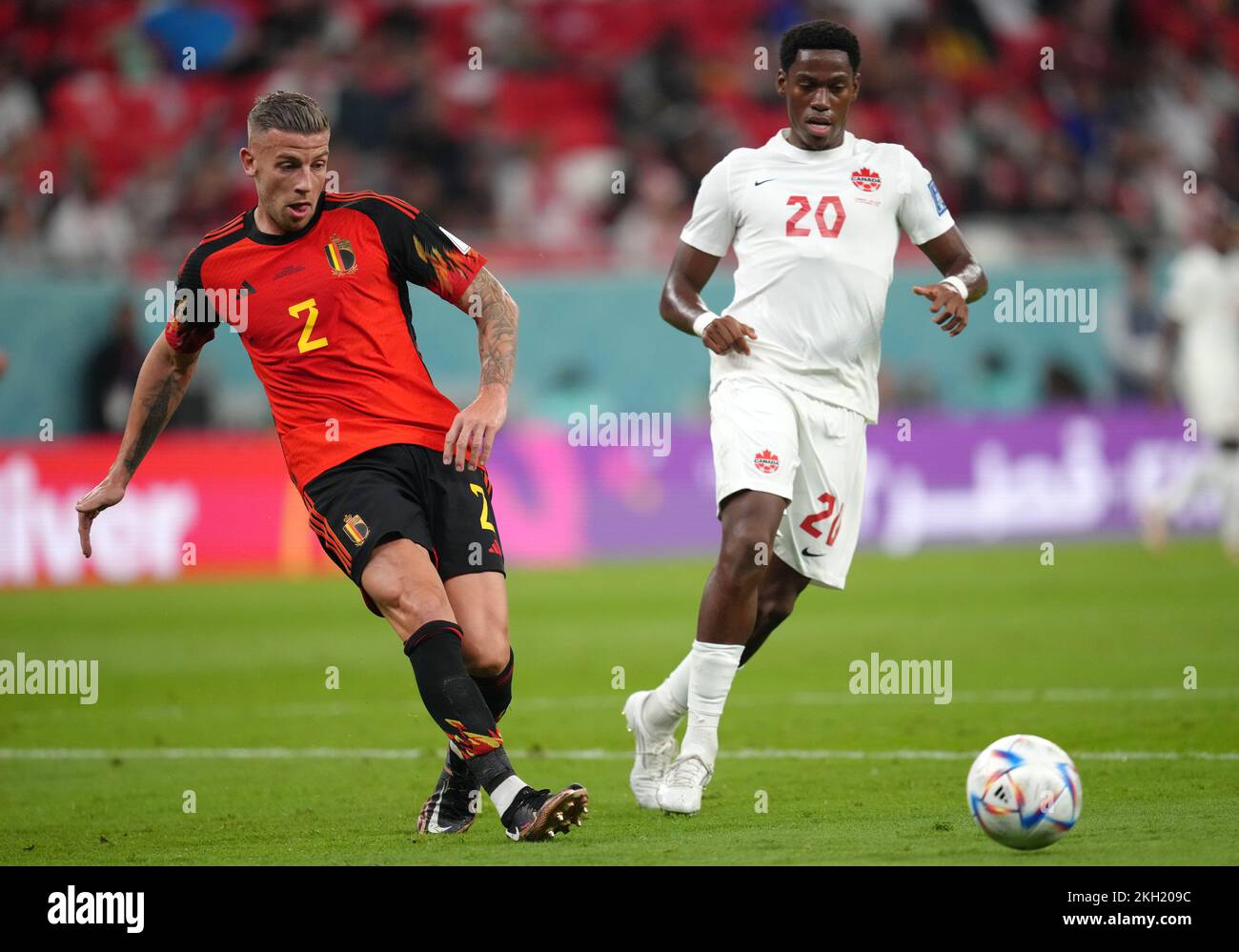 Belgium's Toby Alderweireld (left) and Canada's Jonathan David battle ...