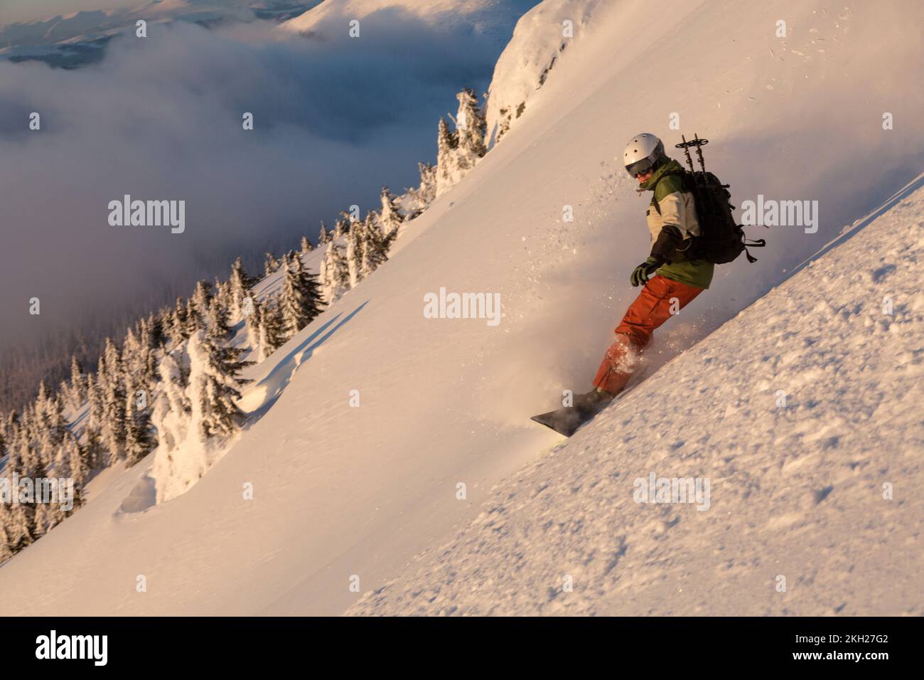 Snowboarder in steep slope hi-res stock photography and images - Alamy