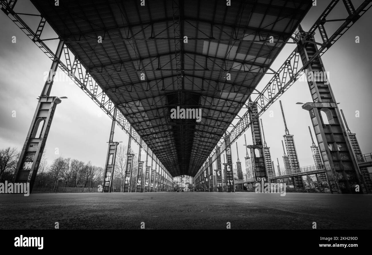 A grayscale shot of the industrial ruins of a factory at Parco Dora ...