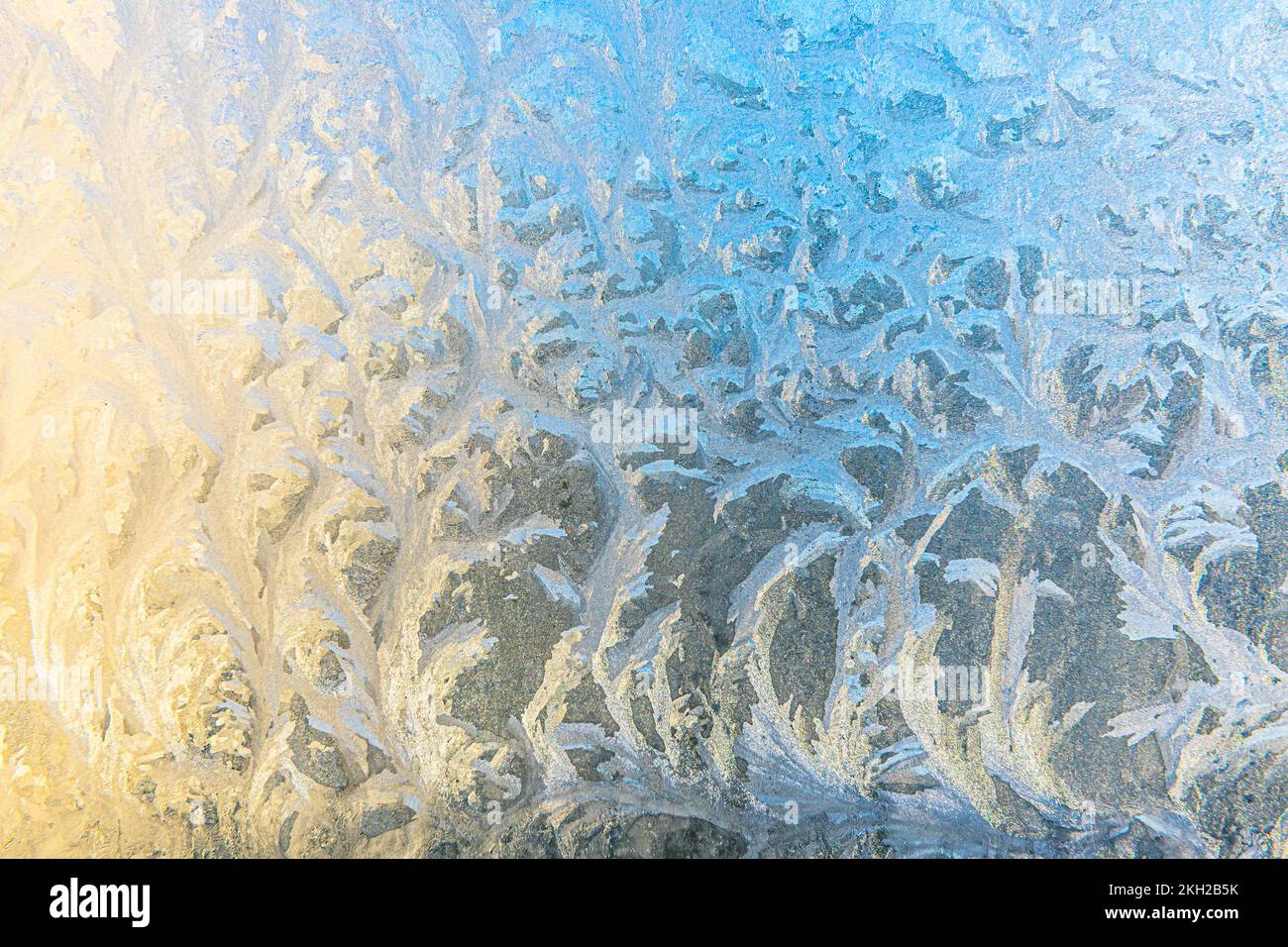 Frozen winter window with shiny ice frost pattern texture. Christmas ...