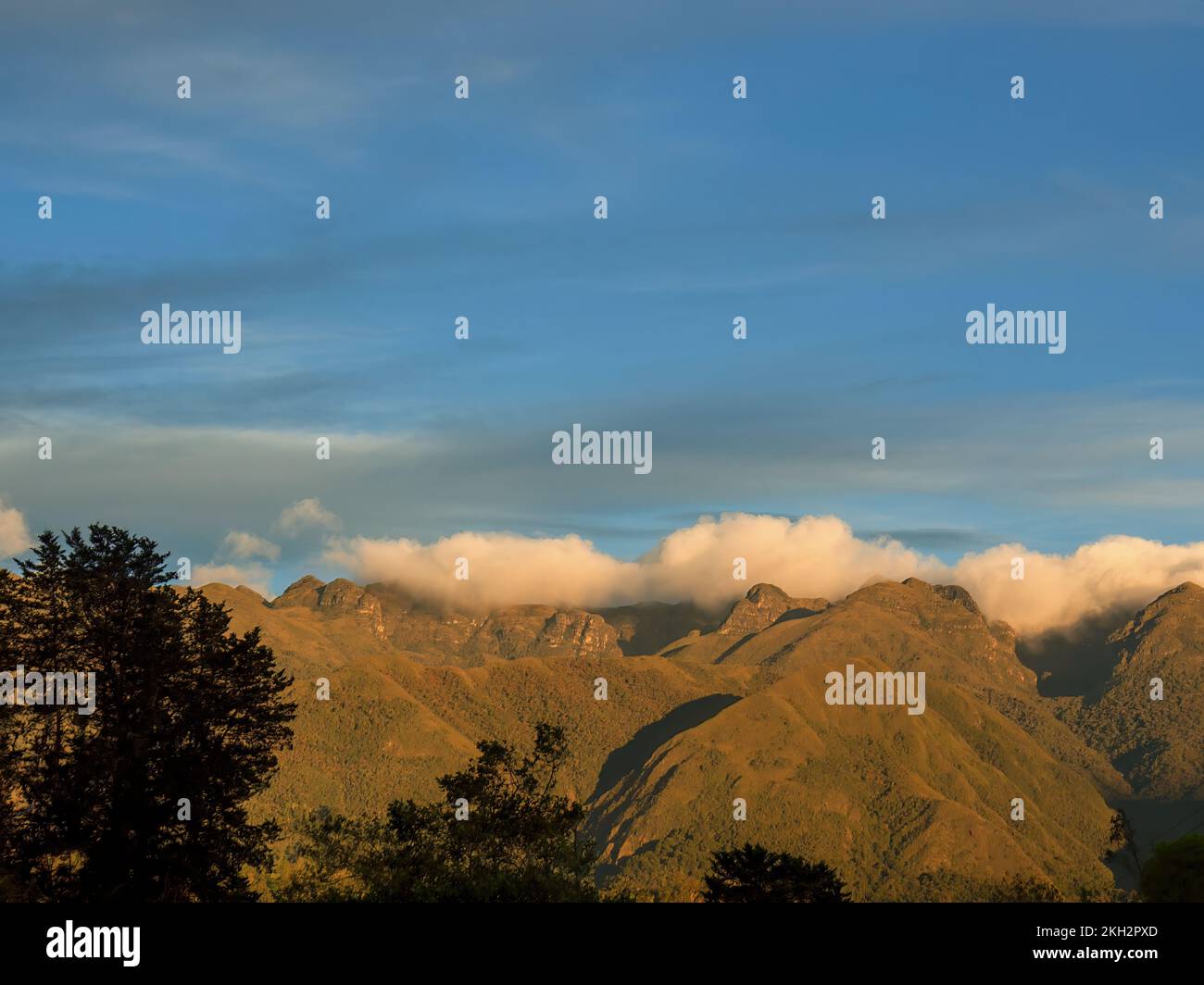 The Iguaque mountain illuminated by the light of the sunset, near the ...