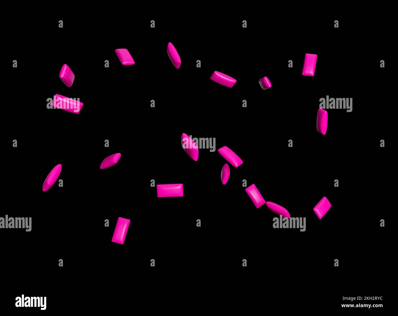 Some Chewing gum pads floating on a black background Stock Photo - Alamy