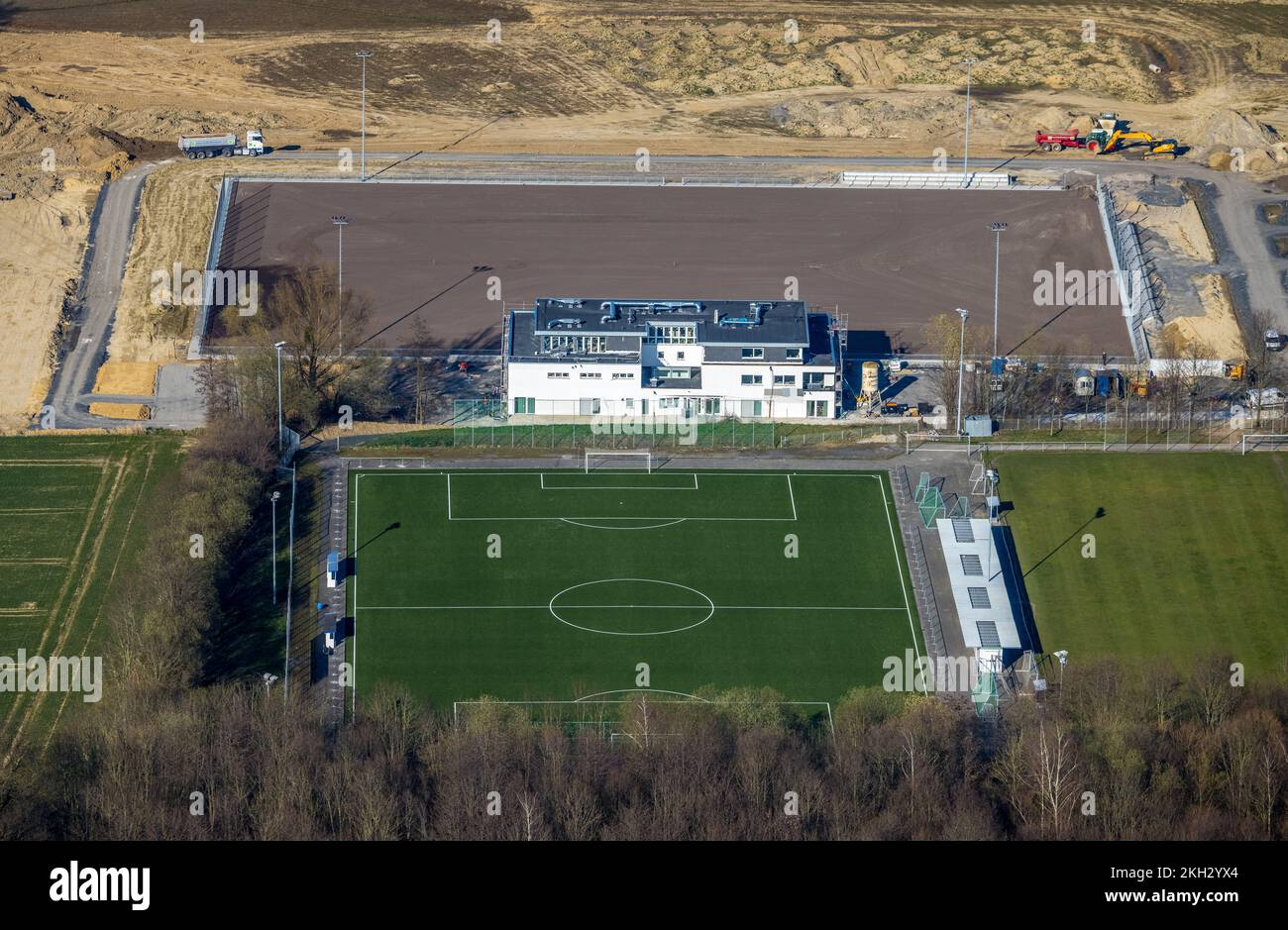 Aerial view, construction site and new building sports field with ...