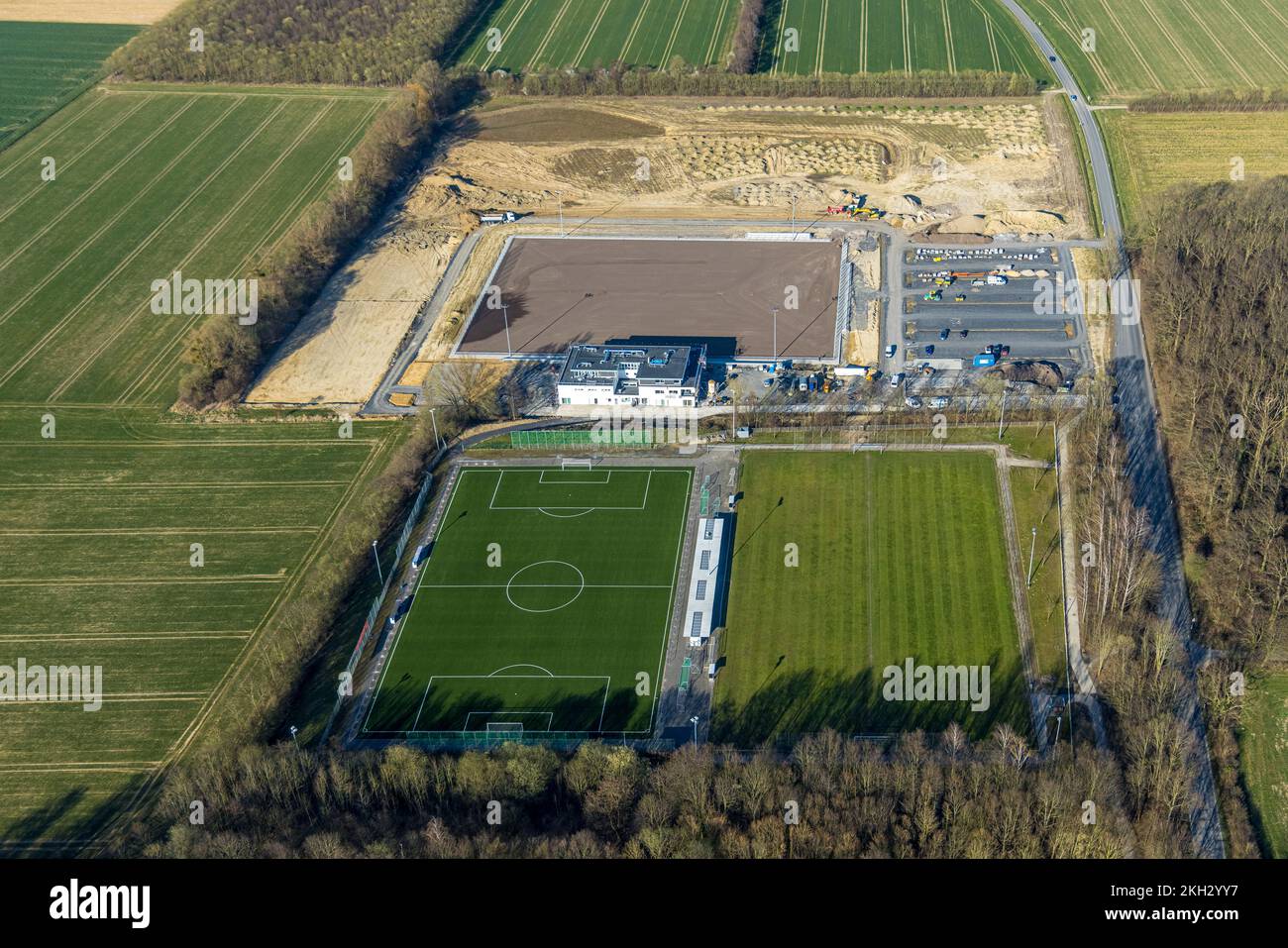 Aerial view, construction site and new building sports field with ...