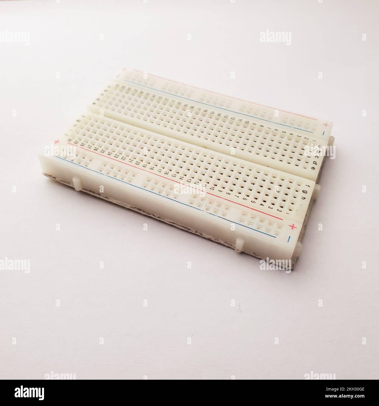 A solderless breadboard isolated on a white background Stock Photo - Alamy