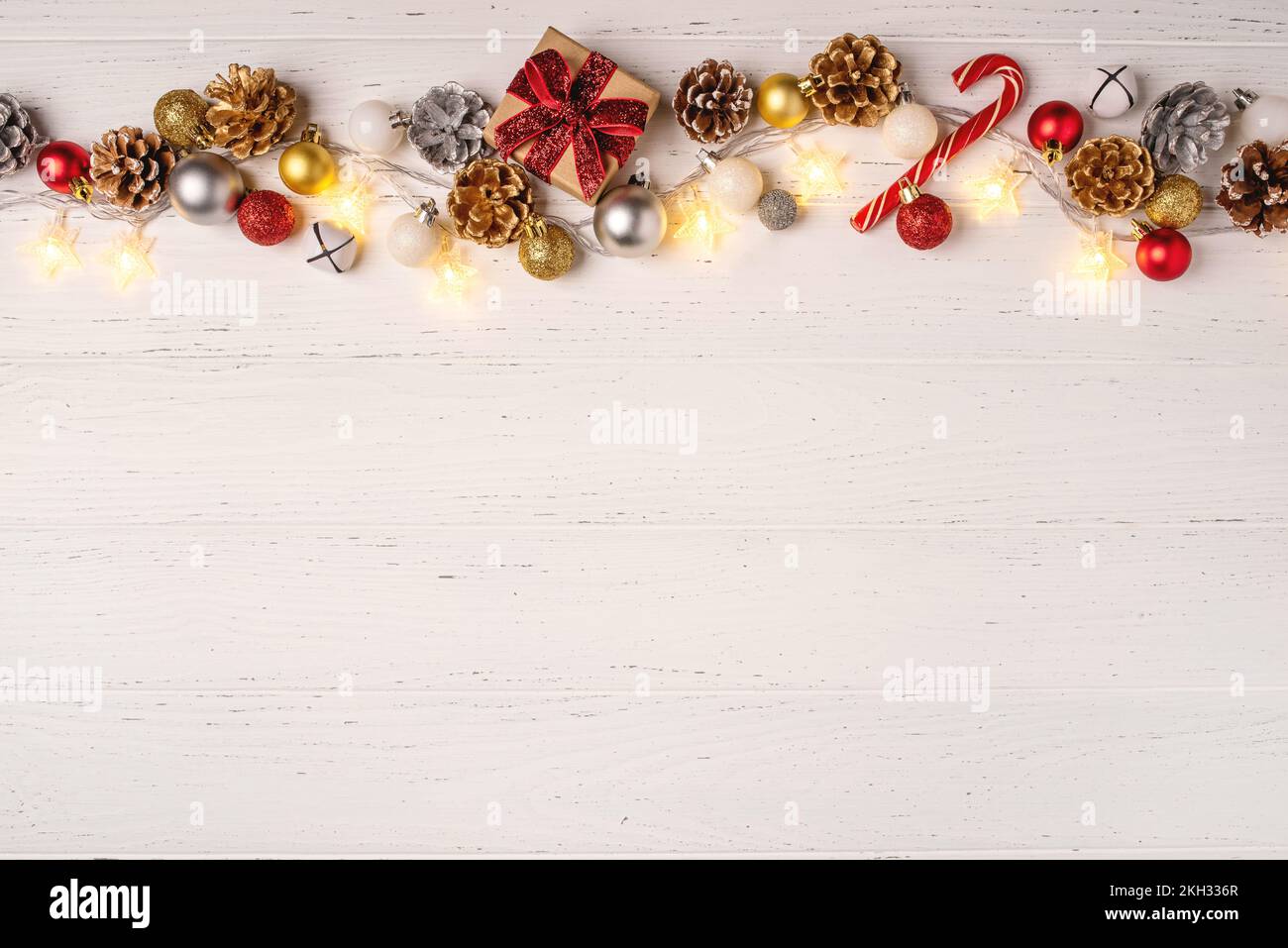 Christmas decorations and a gift box on a white table Stock Photo - Alamy